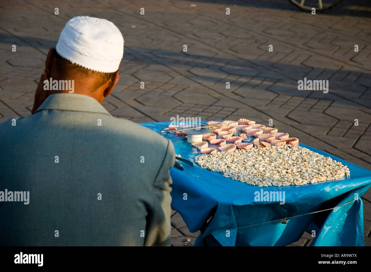Teeth and dentures seller with his banquet in Djemaa el Fna main square ...