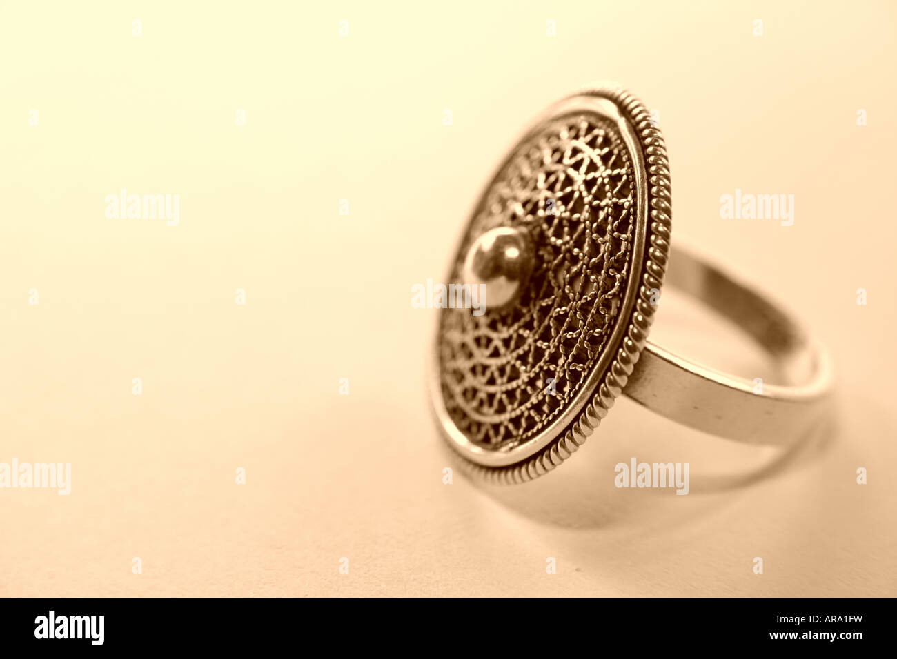 Big ring isolated on yellow Stock Photo - Alamy