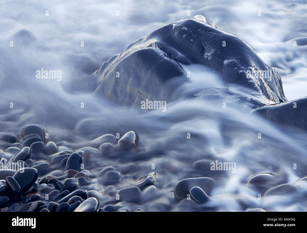 Pebbles and waves at Sandymouth Beach Cornwall UK Stock Photo - Alamy