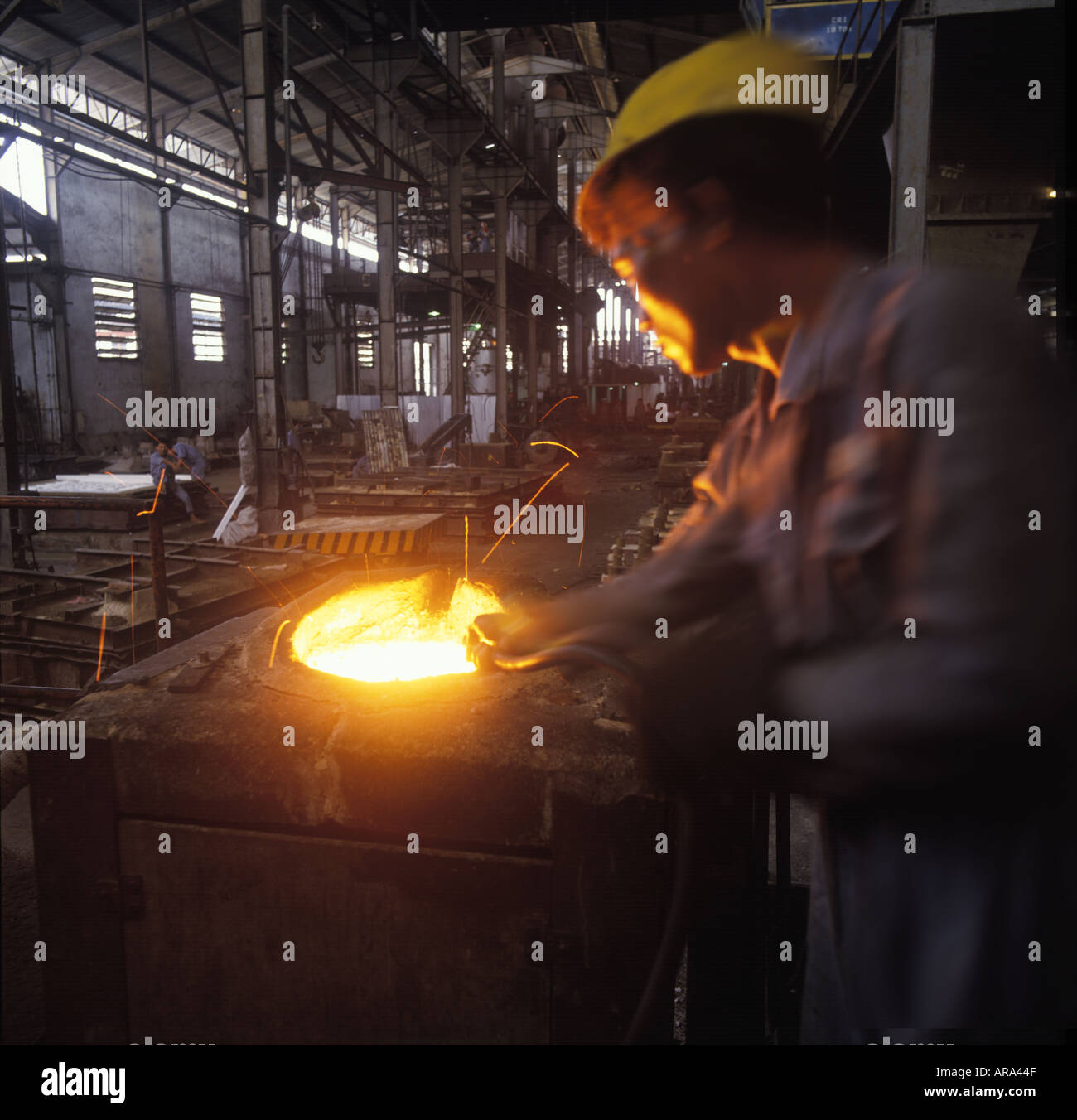 Employee works inside factory manufacturing hi-res stock photography ...
