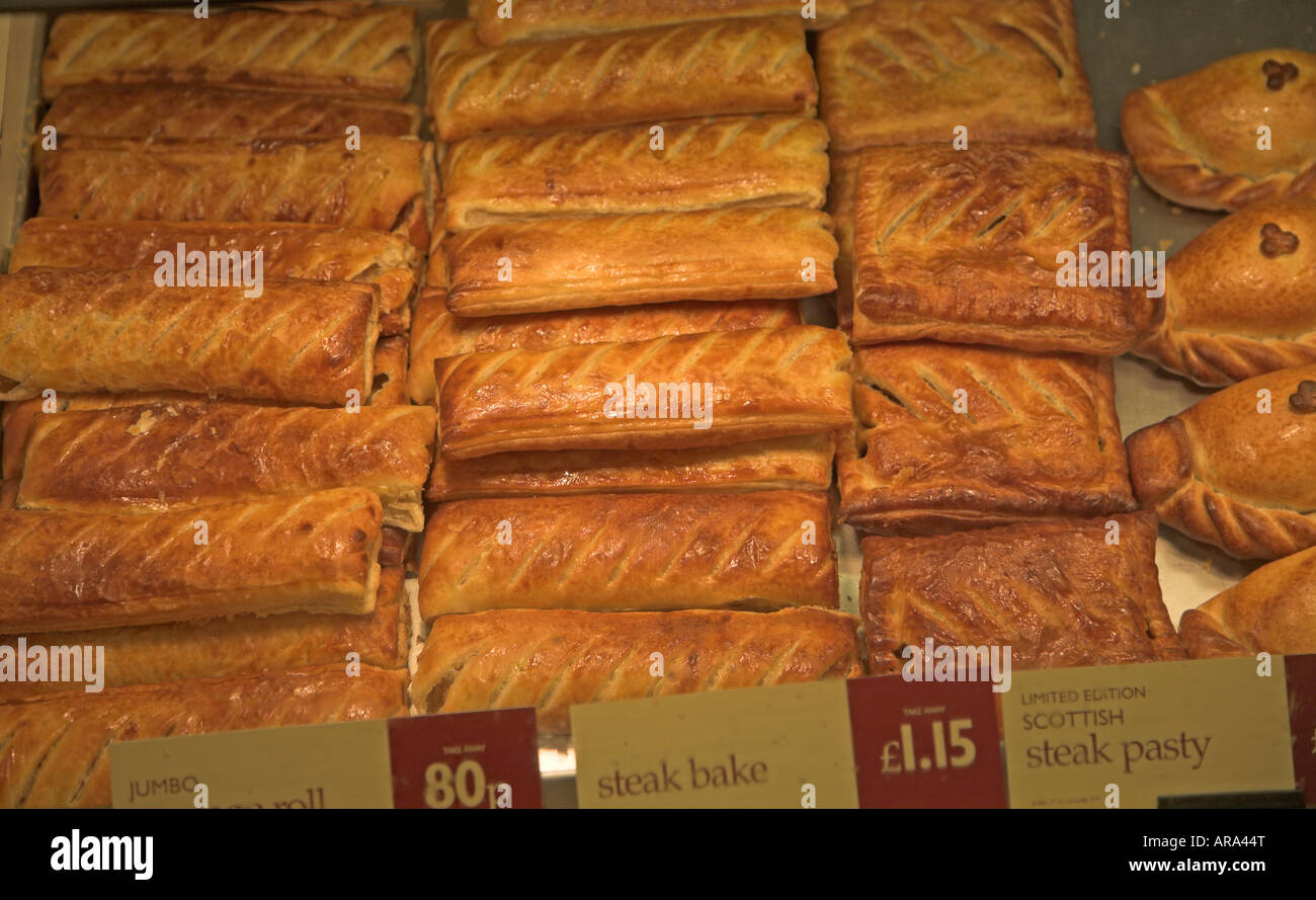 Sausage rolls and pies in hot cabinet display Stock Photo - Alamy