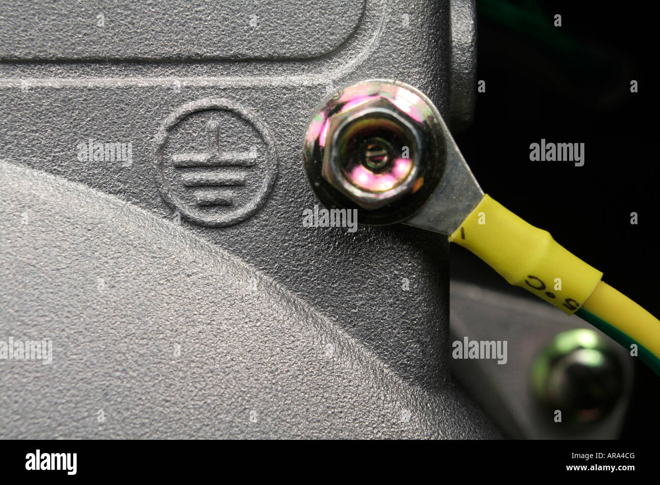 Ground (earth) attachment point on a machine Stock Photo - Alamy