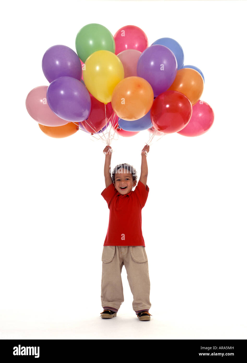 Boy with coloured balloons Stock Photo - Alamy