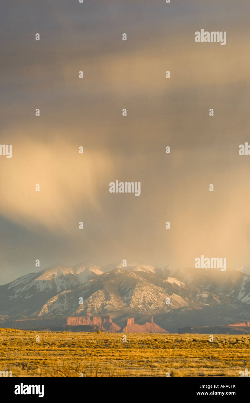 Distant view of a snow storm at sunset over La Sal Mountains, Arches ...