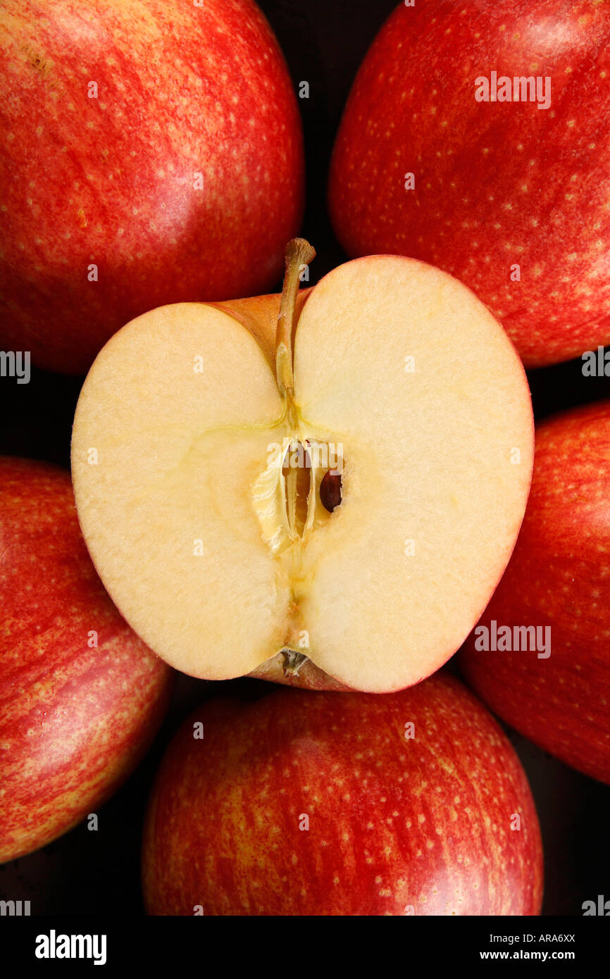cut apple on top of whole apple Stock Photo - Alamy