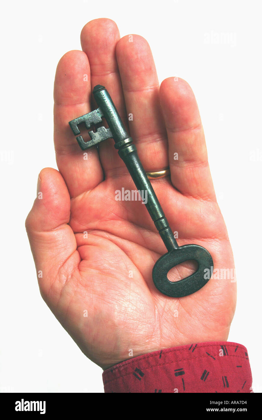 Old key in plam of hand Stock Photo - Alamy