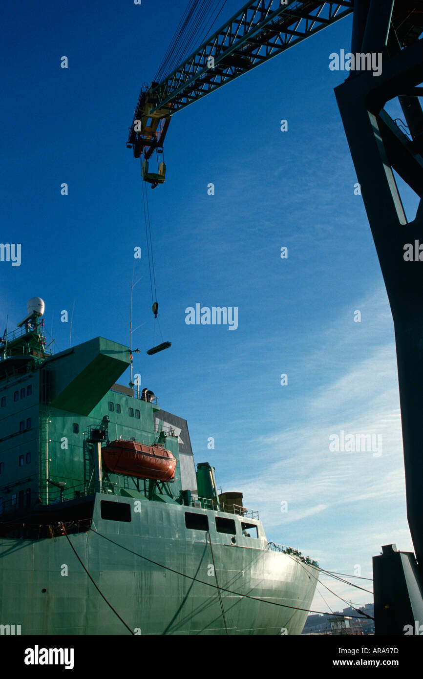Loading on a boat Stock Photo - Alamy