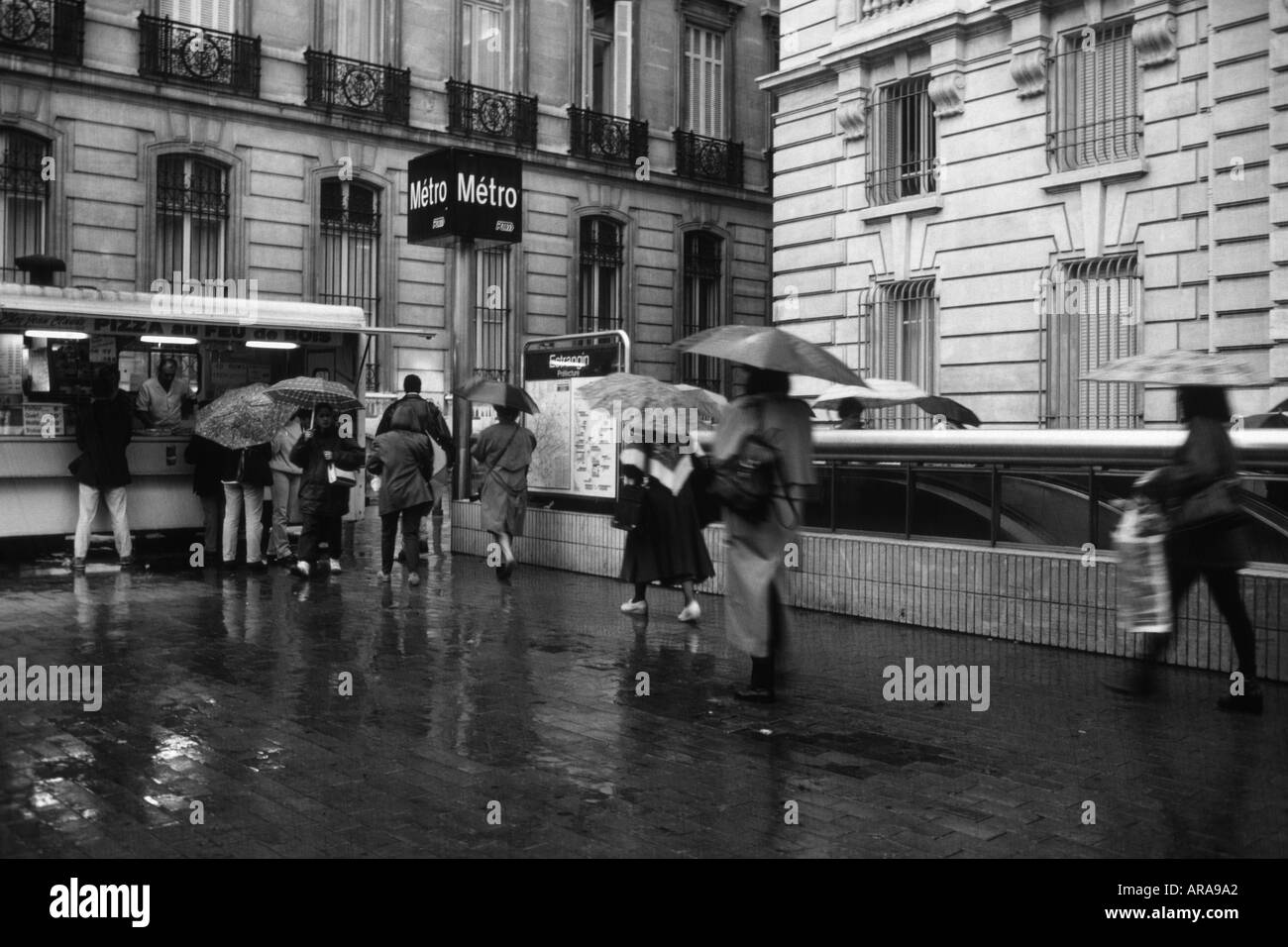 People by subway on rainy day Stock Photo - Alamy