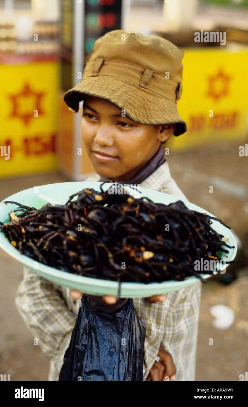 Lady selling the delicacy of fried tarantula spiders, Skuon ...