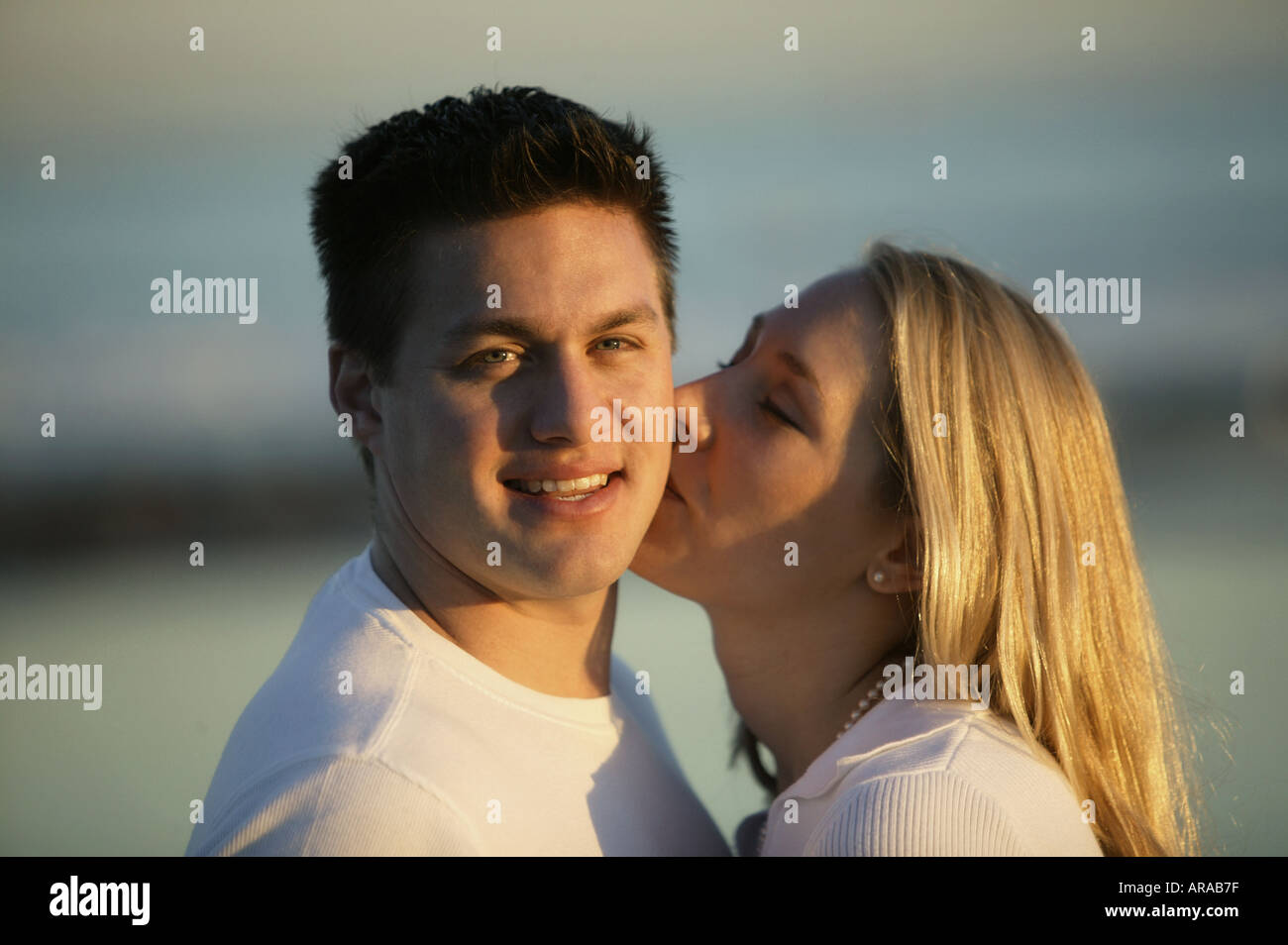 cute couple kissing Stock Photo - Alamy