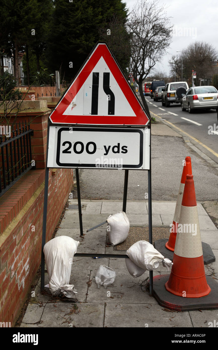 Road narrows traffic sign Stock Photo - Alamy