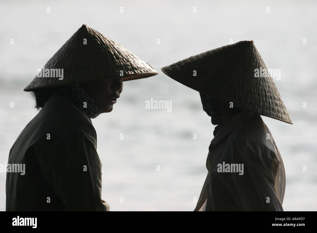 Women in conical straw hats hi-res stock photography and images - Alamy