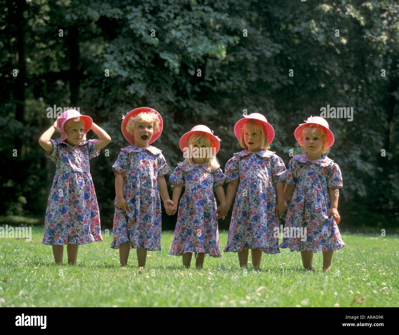 5 girls in a row with pink hats Stock Photo - Alamy