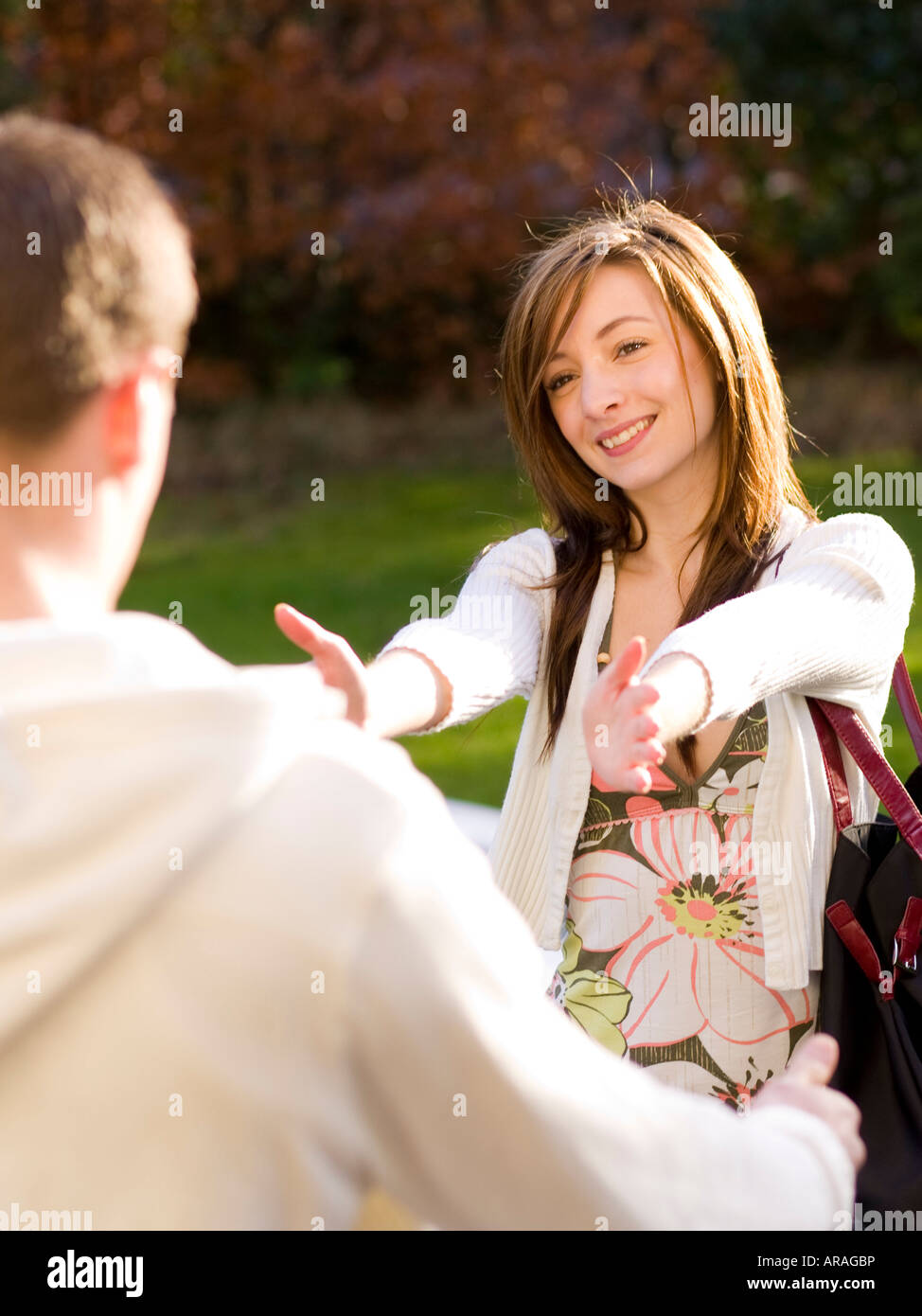 Girl greeting partner Stock Photo - Alamy