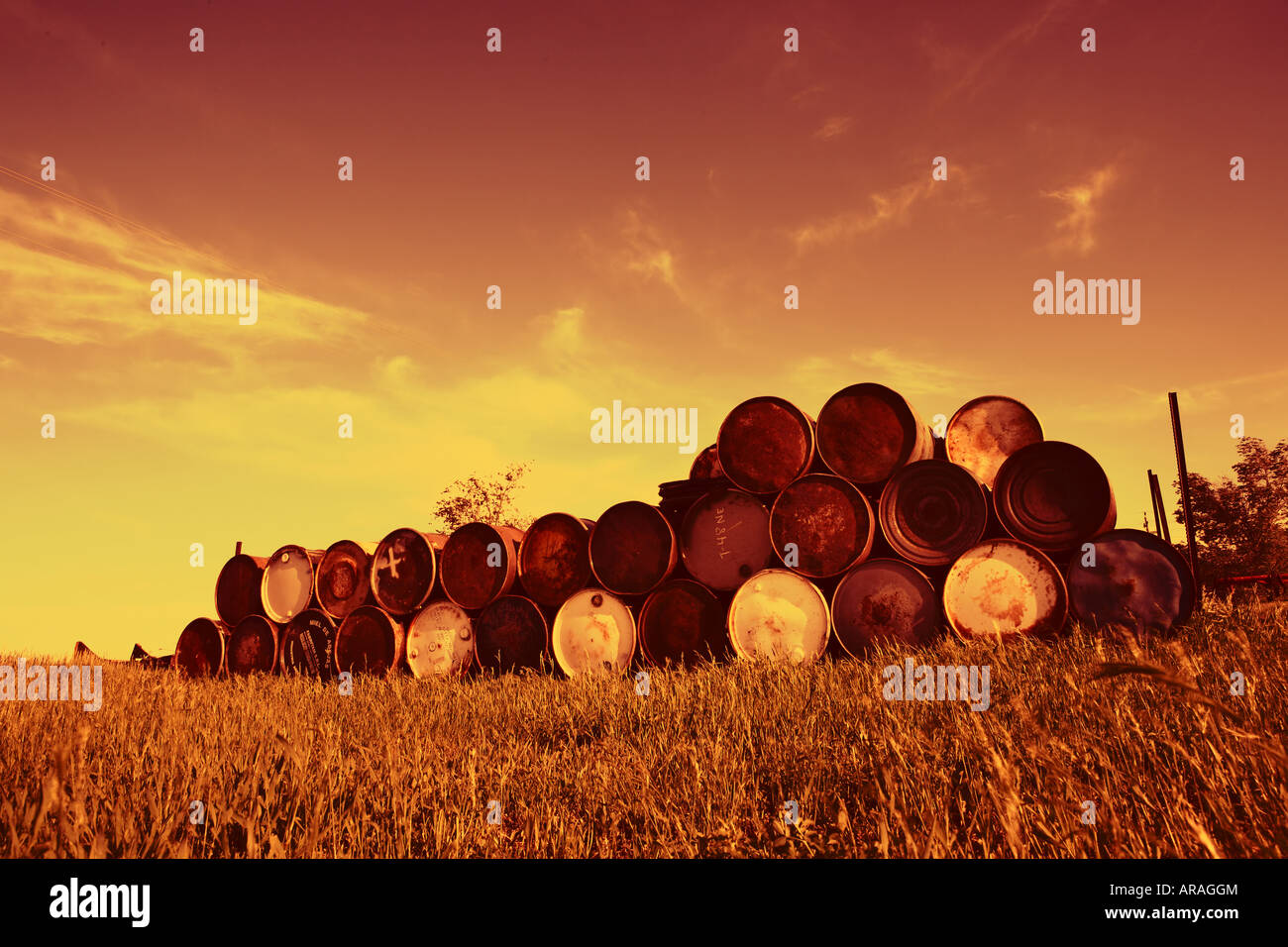 A stack of old rusty oil drums in a farmers field Stock Photo - Alamy