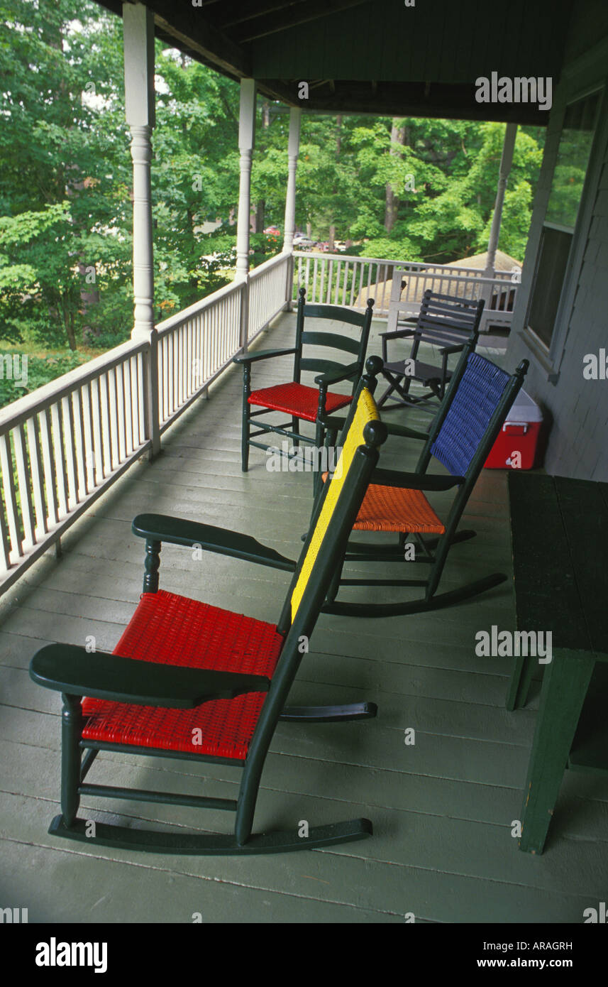 colorful rocking chairs on summer cabin home porch Stock Photo - Alamy