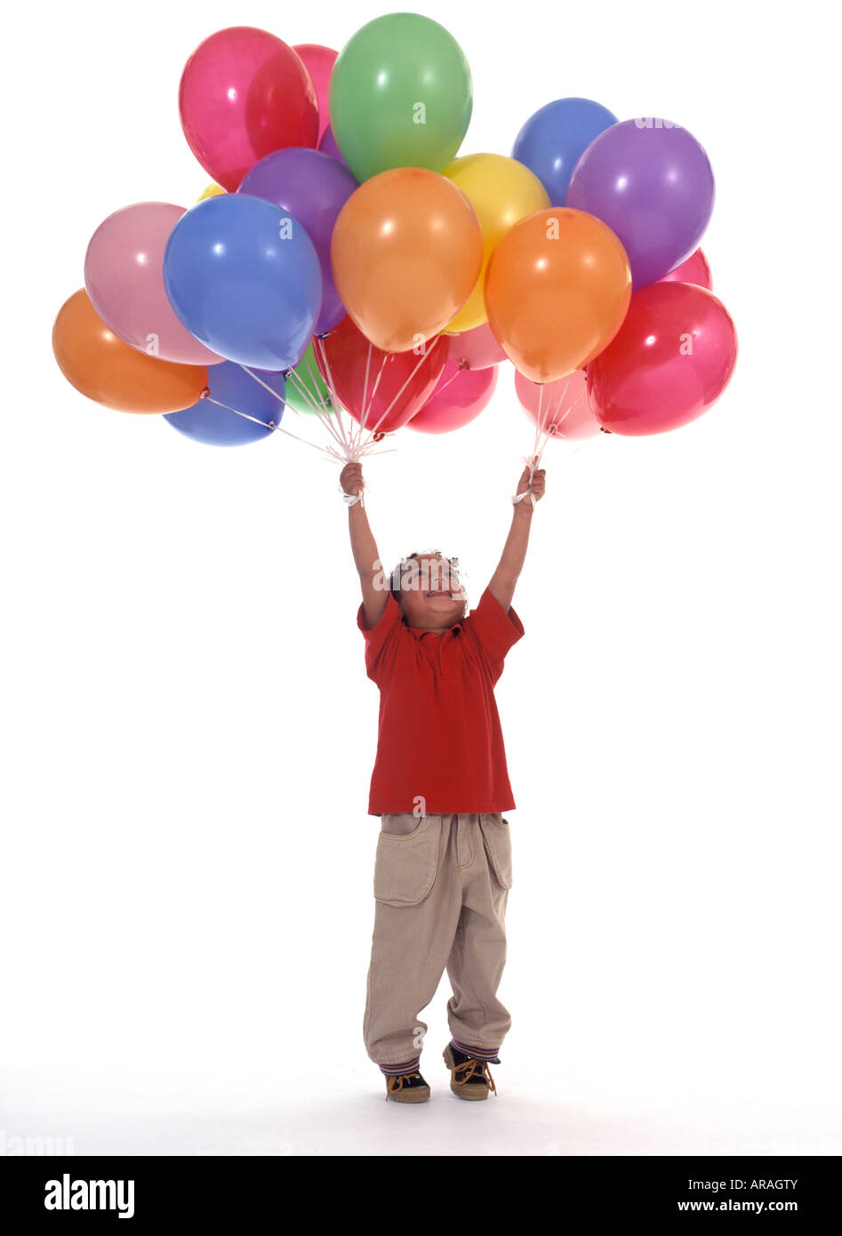Boy with coloured balloons Stock Photo - Alamy