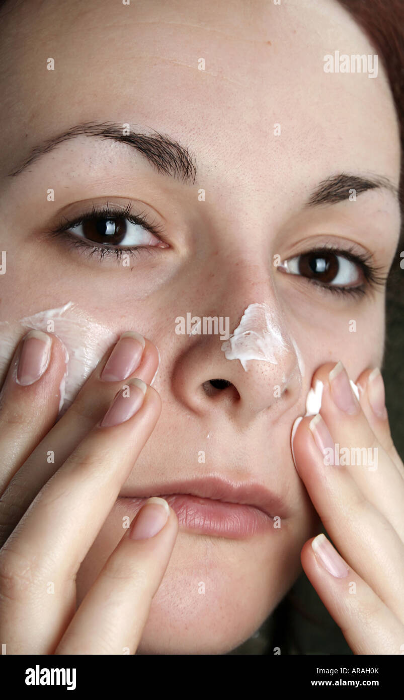 Girl with cream on her face Stock Photo - Alamy