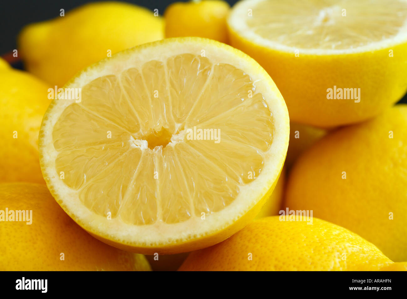 Bowl of lemons with one cut open Stock Photo - Alamy