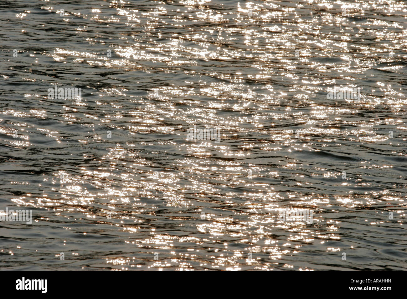 The sun reflecting off the water Stock Photo - Alamy
