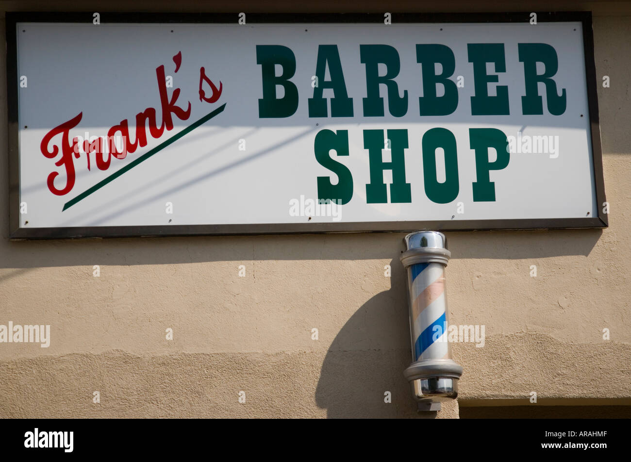 Sign outside a barber shop Stock Photo - Alamy