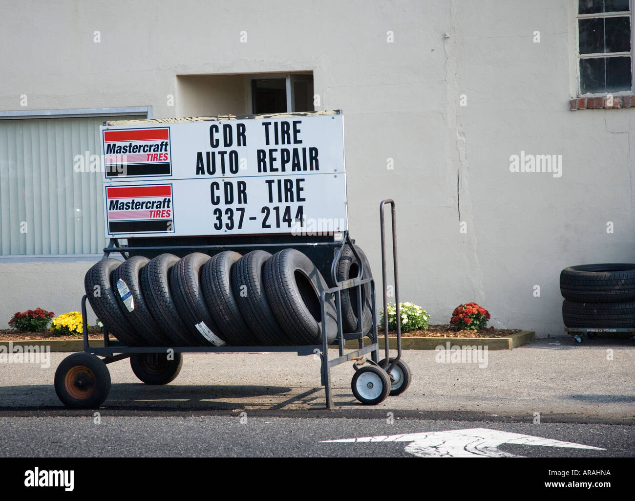 Rack of tires at an auto repair shop Stock Photo - Alamy