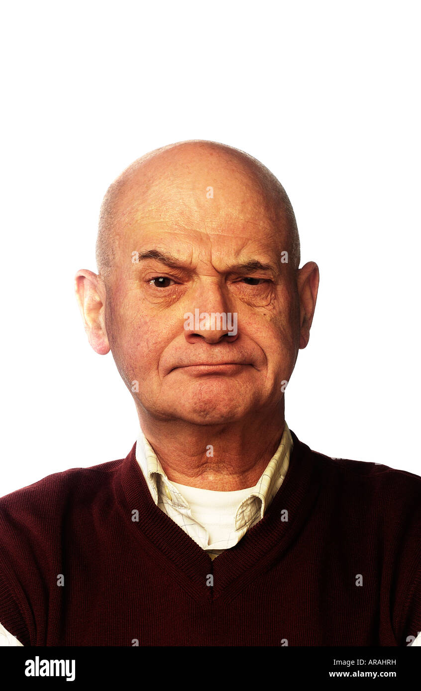 Older balding man looking very seriously Stock Photo - Alamy