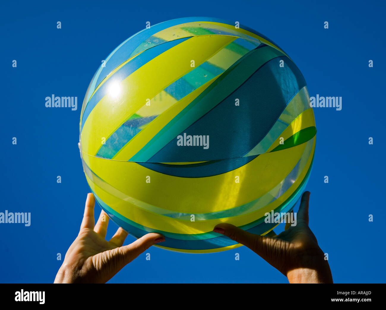Hands holding a ball Stock Photo - Alamy