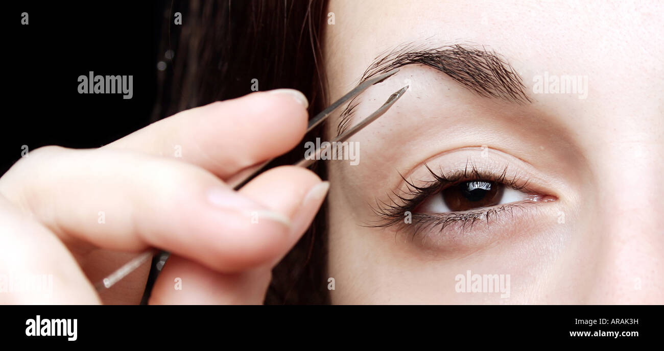girl twitching her brows Stock Photo - Alamy