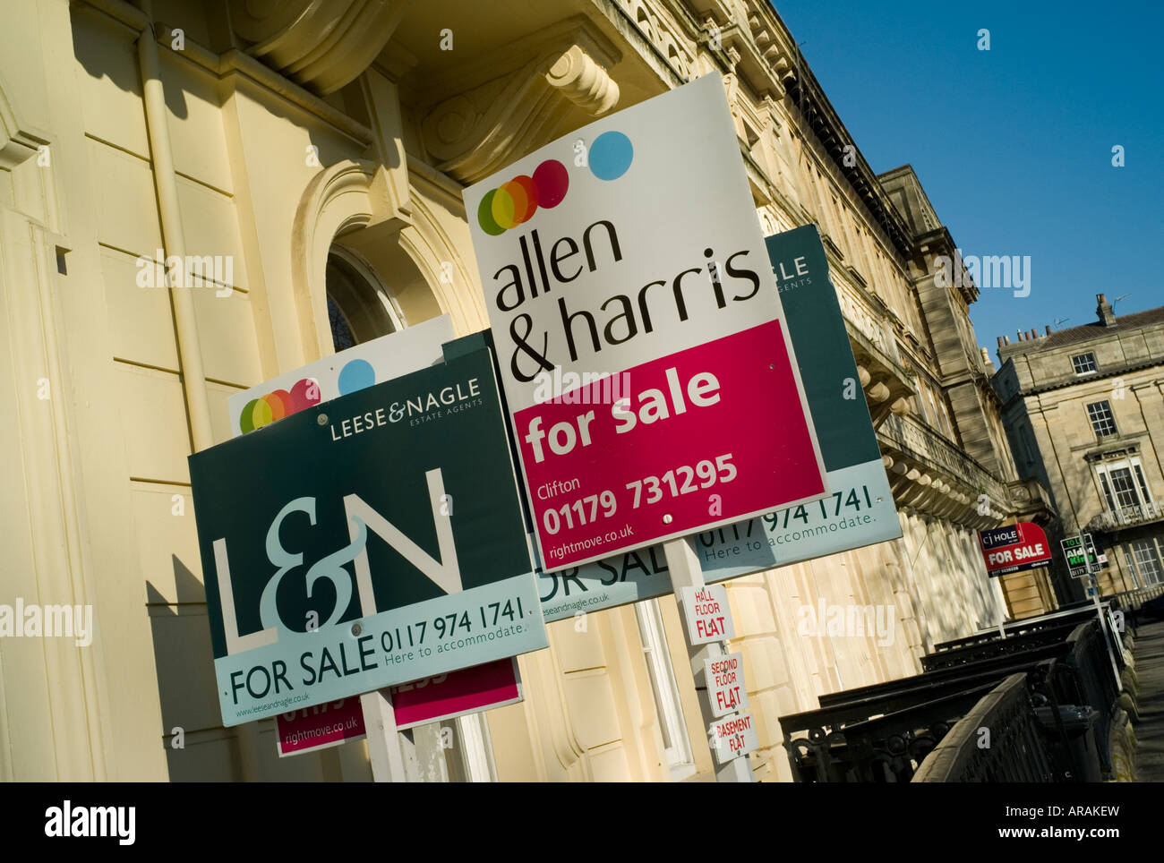 'For Sale' signs outside properties Stock Photo - Alamy