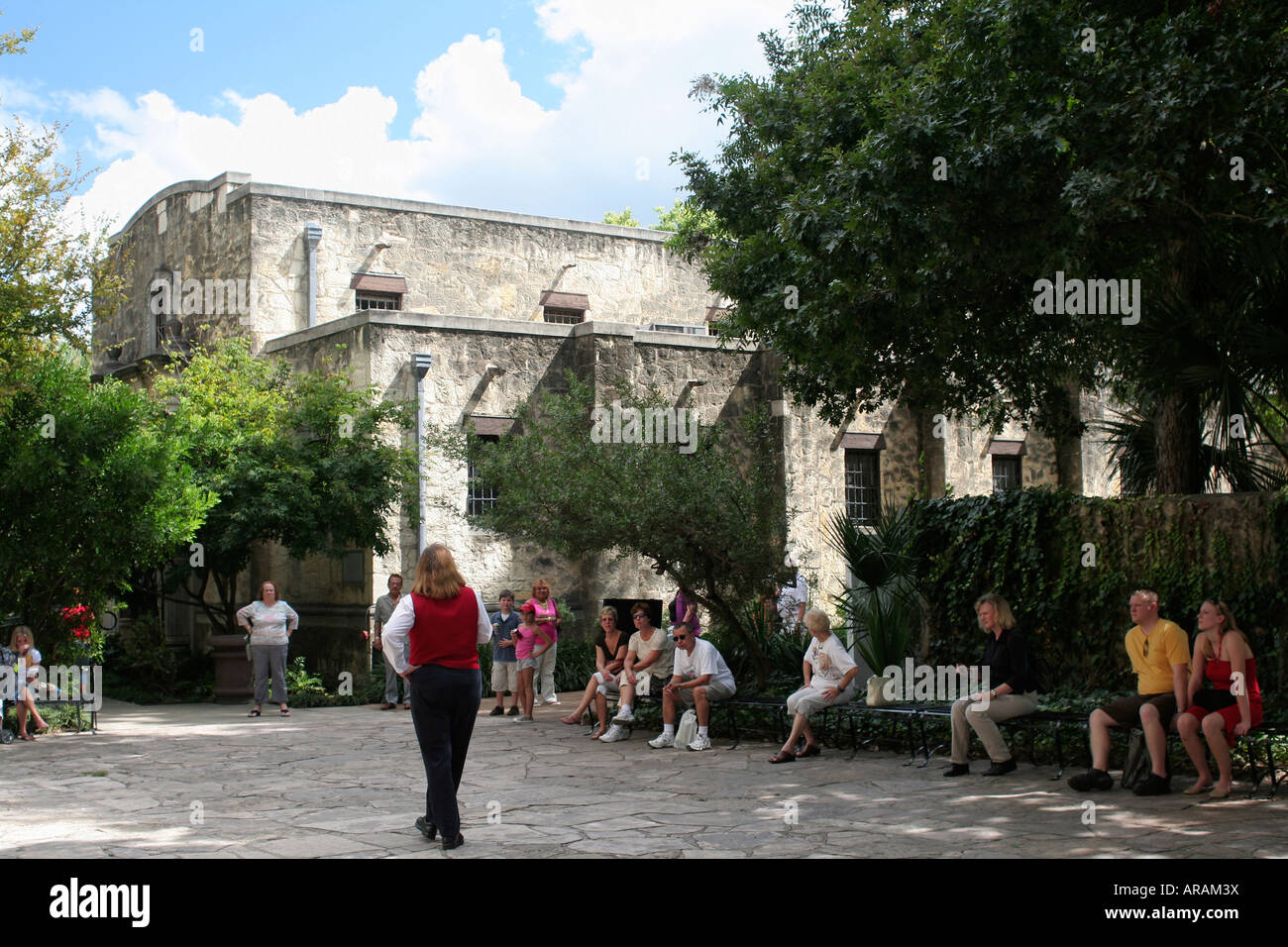 Tour guide lecturing group, The Alamo Stock Photo - Alamy