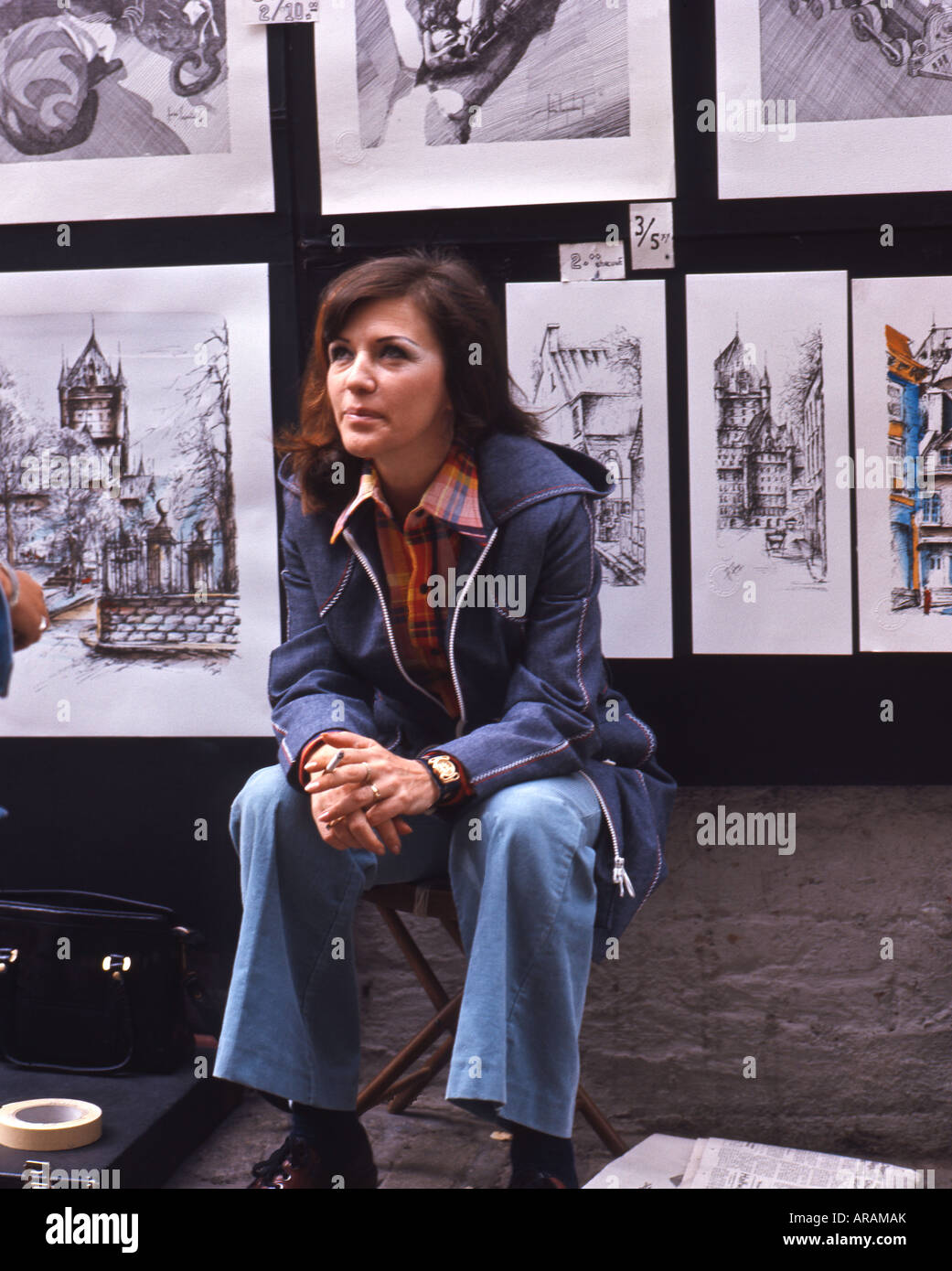 Female artist is selling her paintings at the Art show in Quebec City ...
