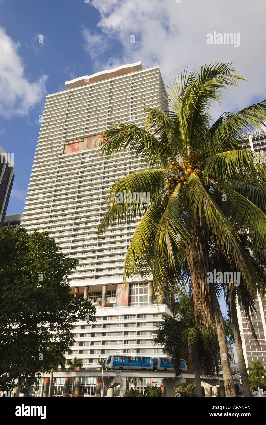 Monorail train passes through tree lined Bayfront Park, Miami, Florida ...