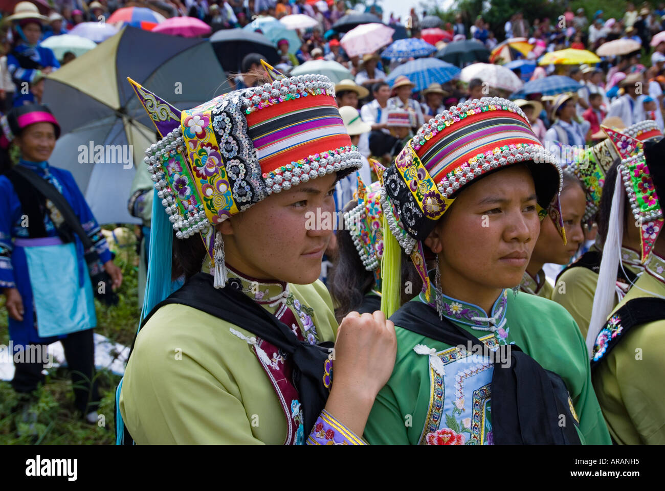 Costumed Sani ethnic minority girls wait to perform Torch Festival in ...