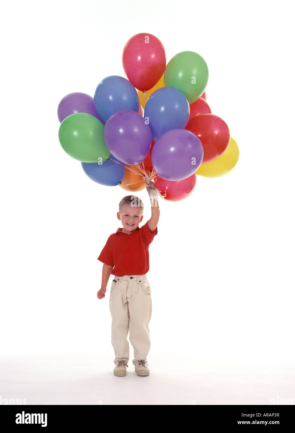 Boy with coloured balloons Stock Photo - Alamy