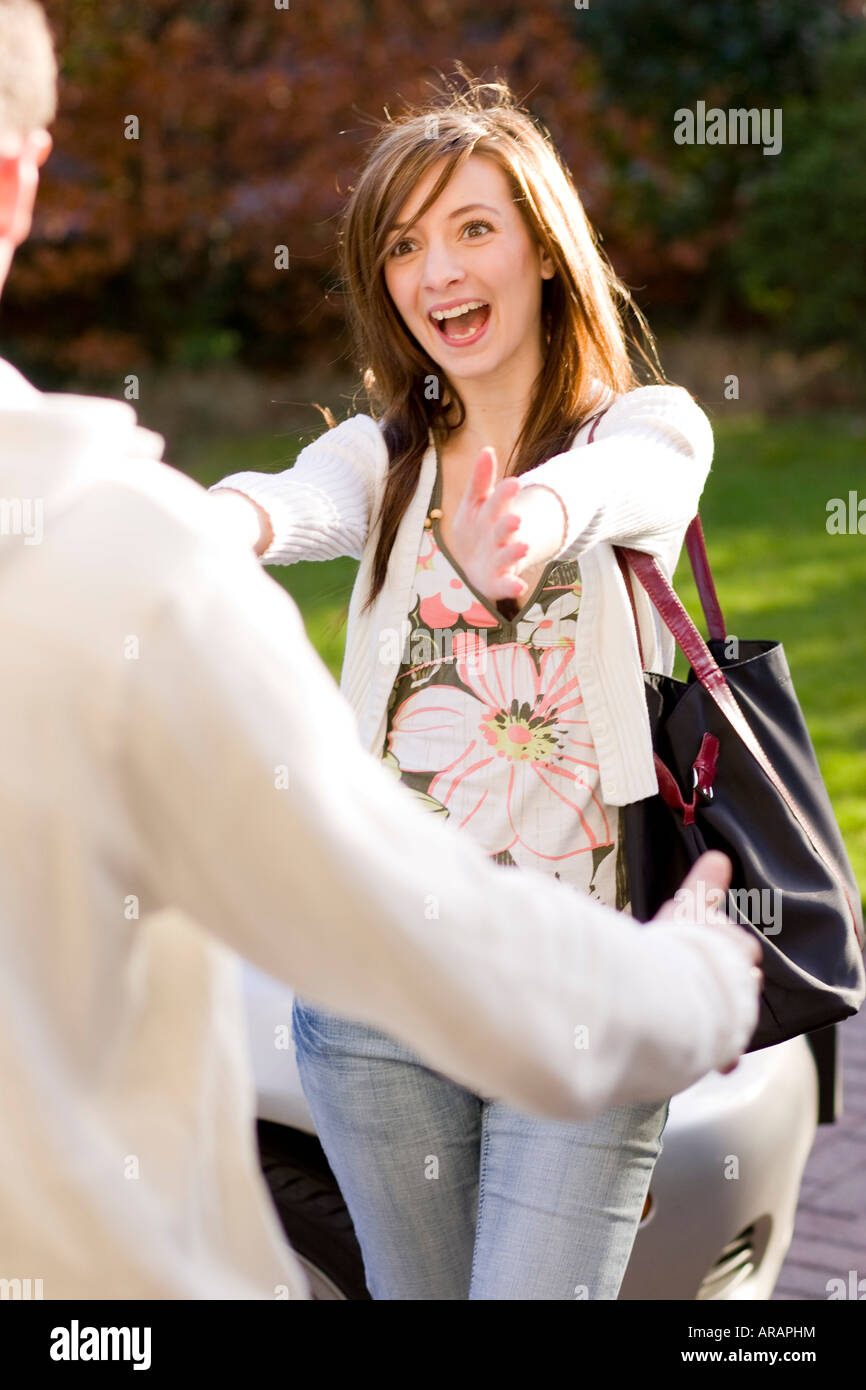 Girl greeting partner Stock Photo - Alamy
