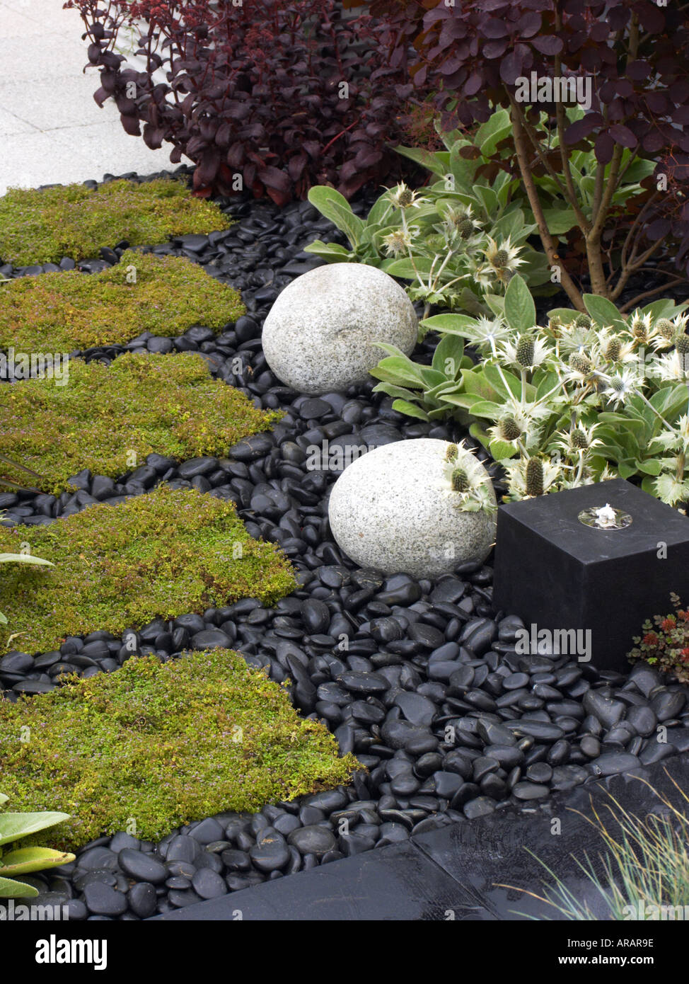 Tatton Flower Show steps of turf through pebbles with foliage planting ...