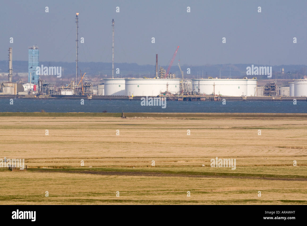 View over the North Kent Marshes to oil and chemical refining and ...