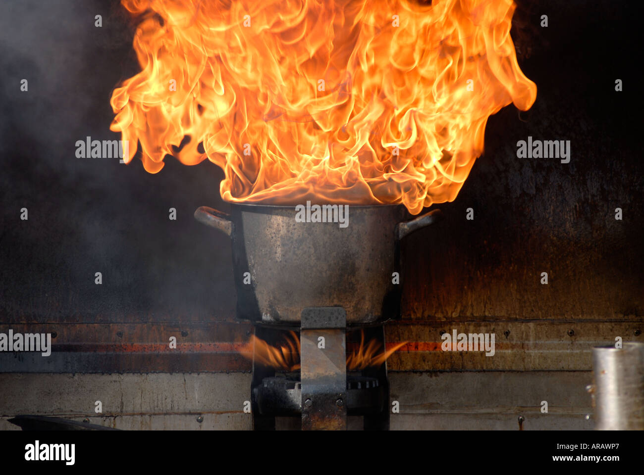Demonstration by a fire brigade of what happens when a chip pan ...