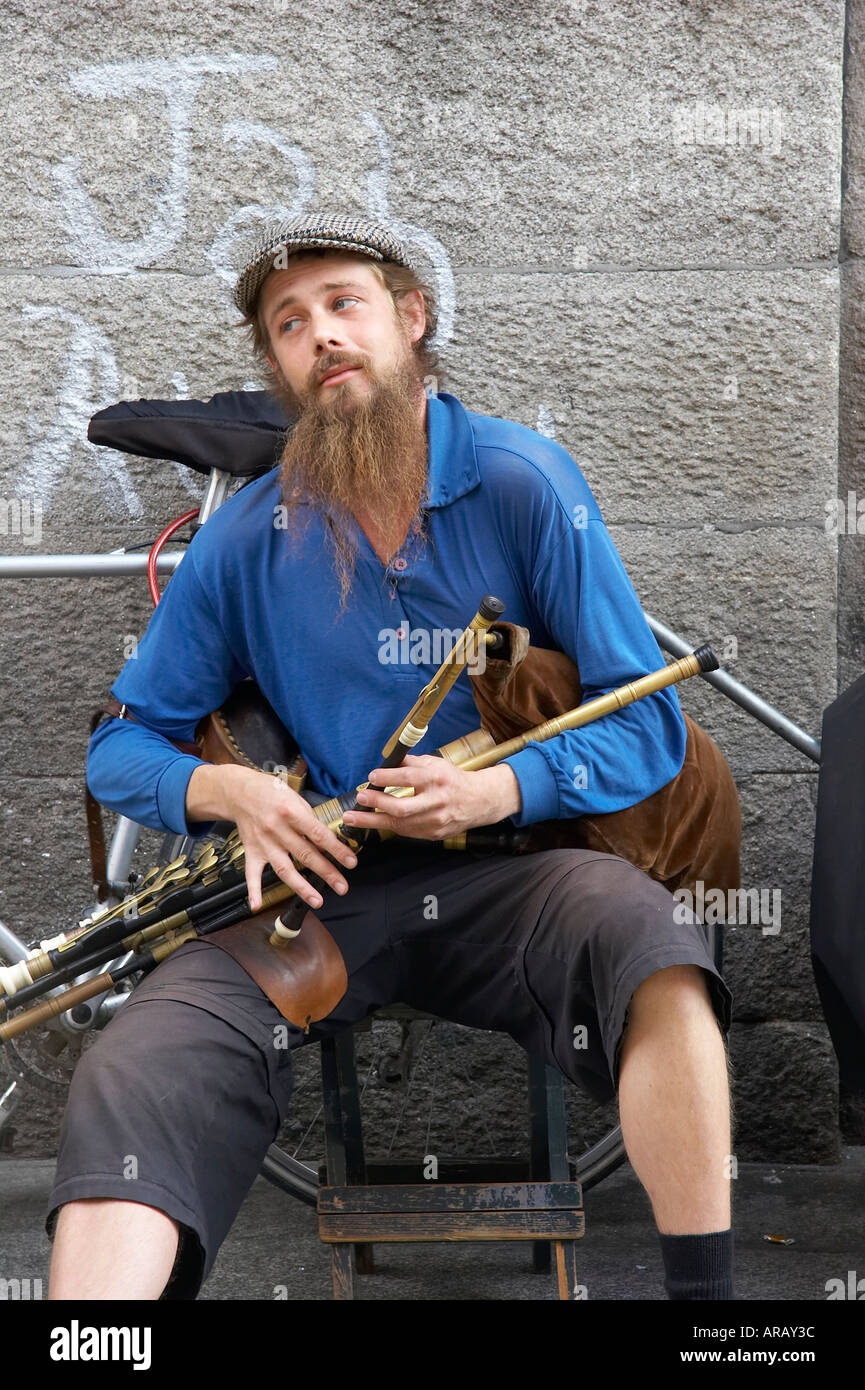 street musician with pipe Stock Photo - Alamy