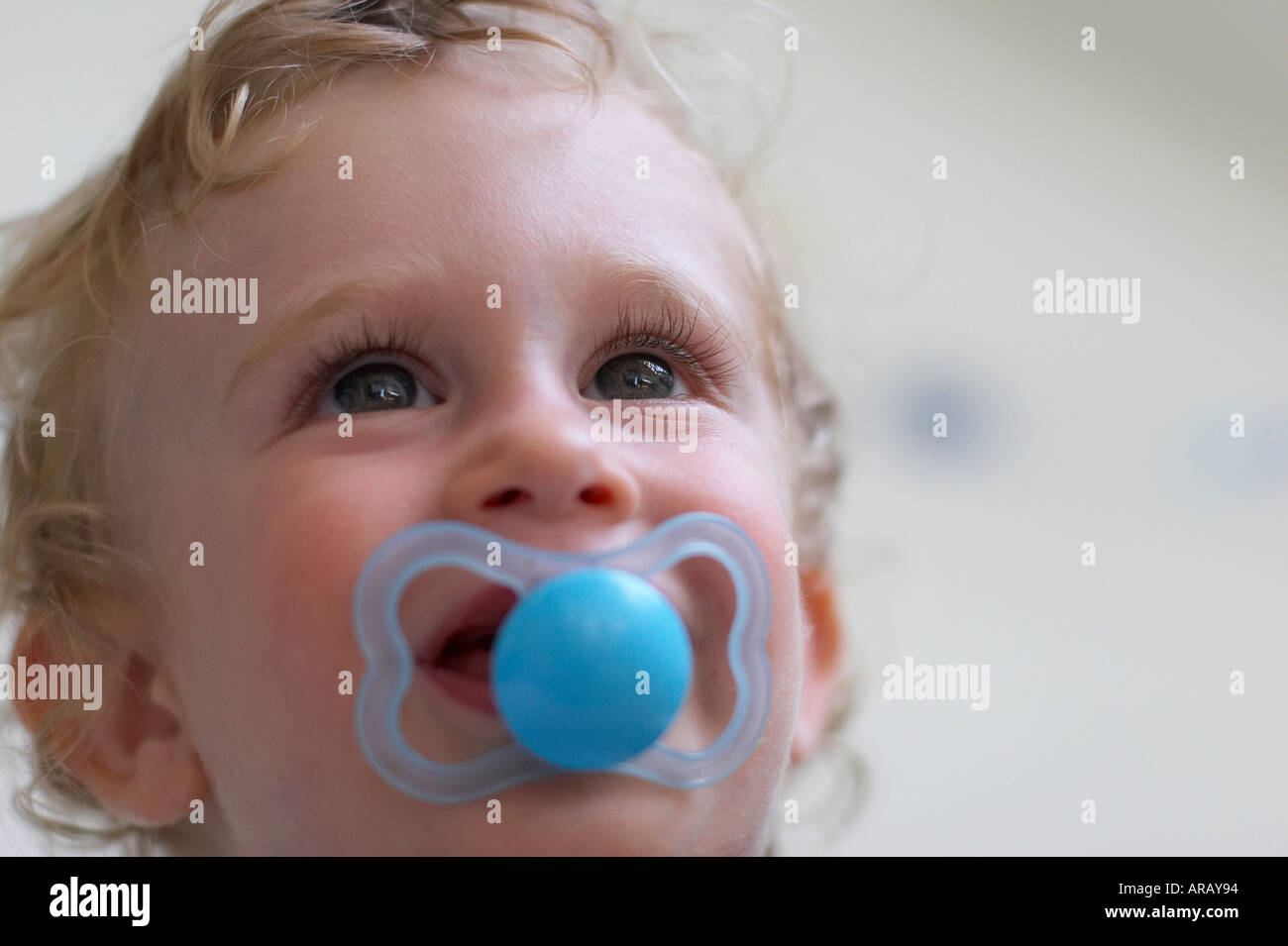 smiling baby with dummy Stock Photo - Alamy