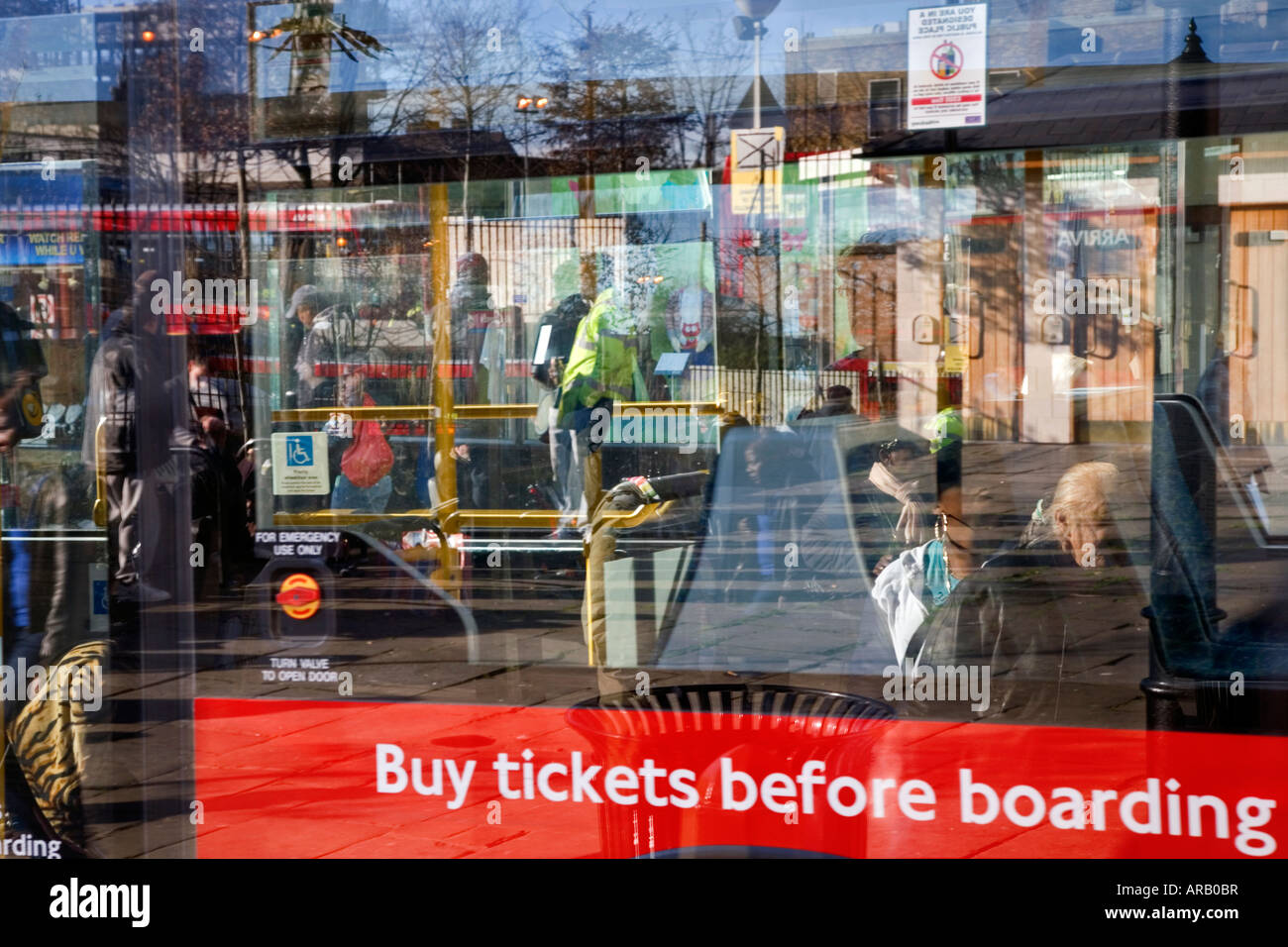 a london bus seen in reflection Stock Photo - Alamy