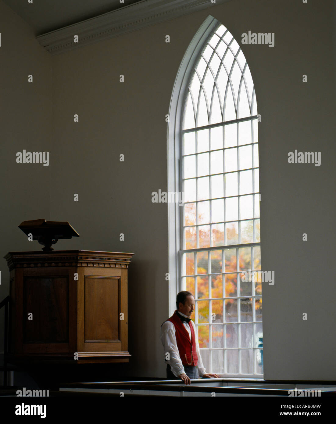 Priest in his church bt large window in the 19th century Stock Photo ...