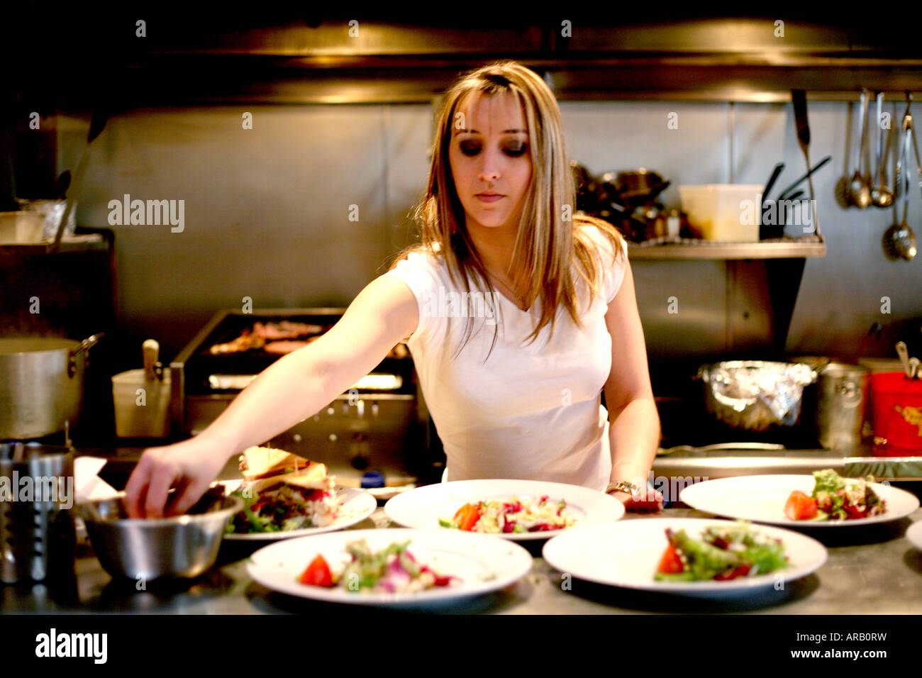Waitress gets food ready for serving in restaurant London 2007 Stock ...
