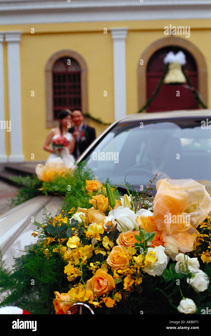 Car Decorated for Wedding, Bride and Groom in Background Stock Photo ...