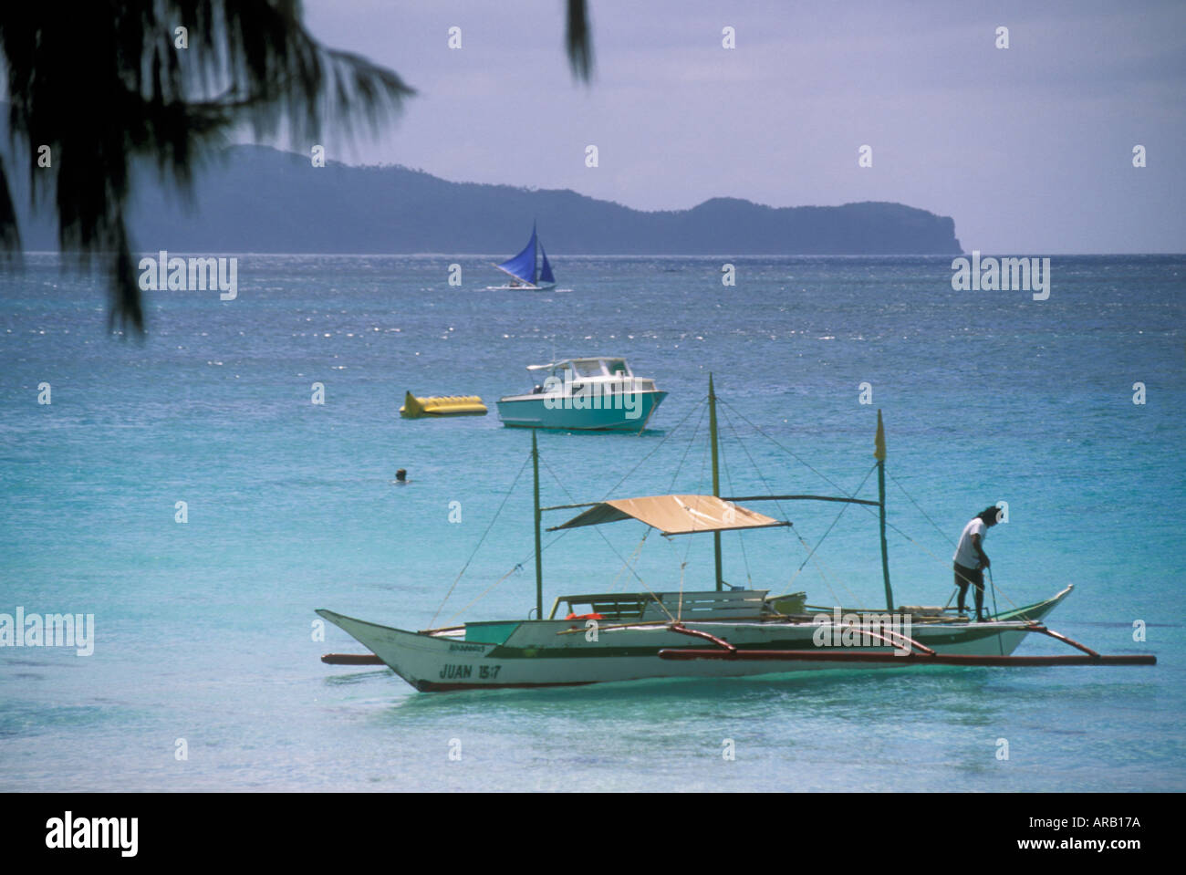 Philippines Boracay Man On His Boat In Tropical Paradise Stock Photo ...