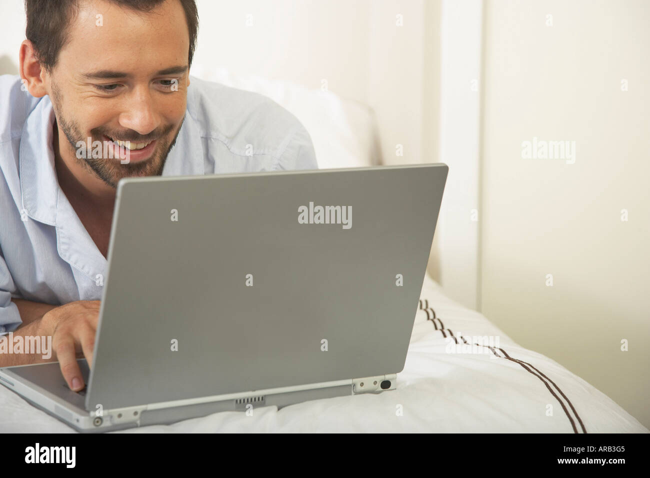 Man lying on stomach using hi-res stock photography and images - Alamy