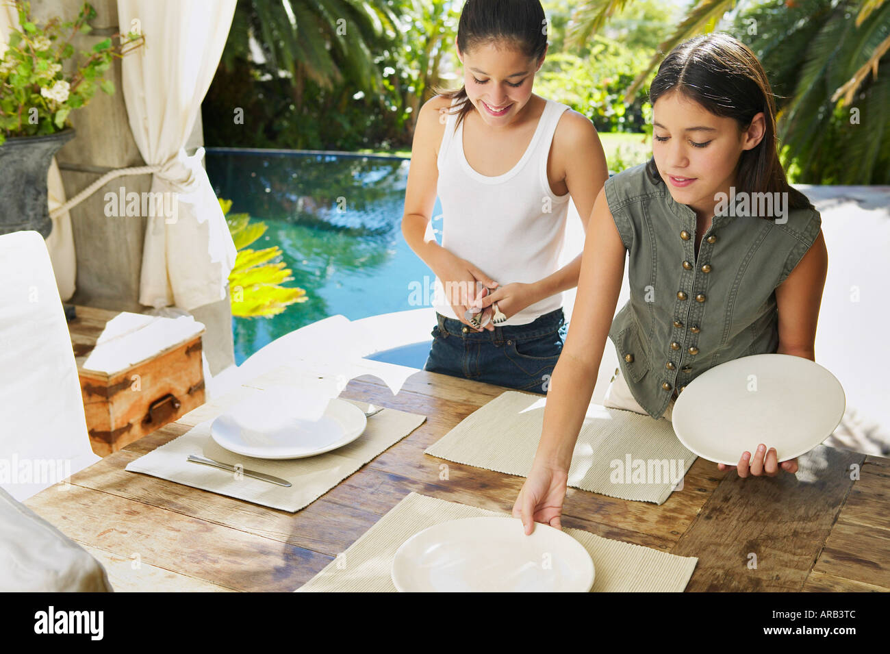 Teen helping to dress up hi-res stock photography and images - Alamy