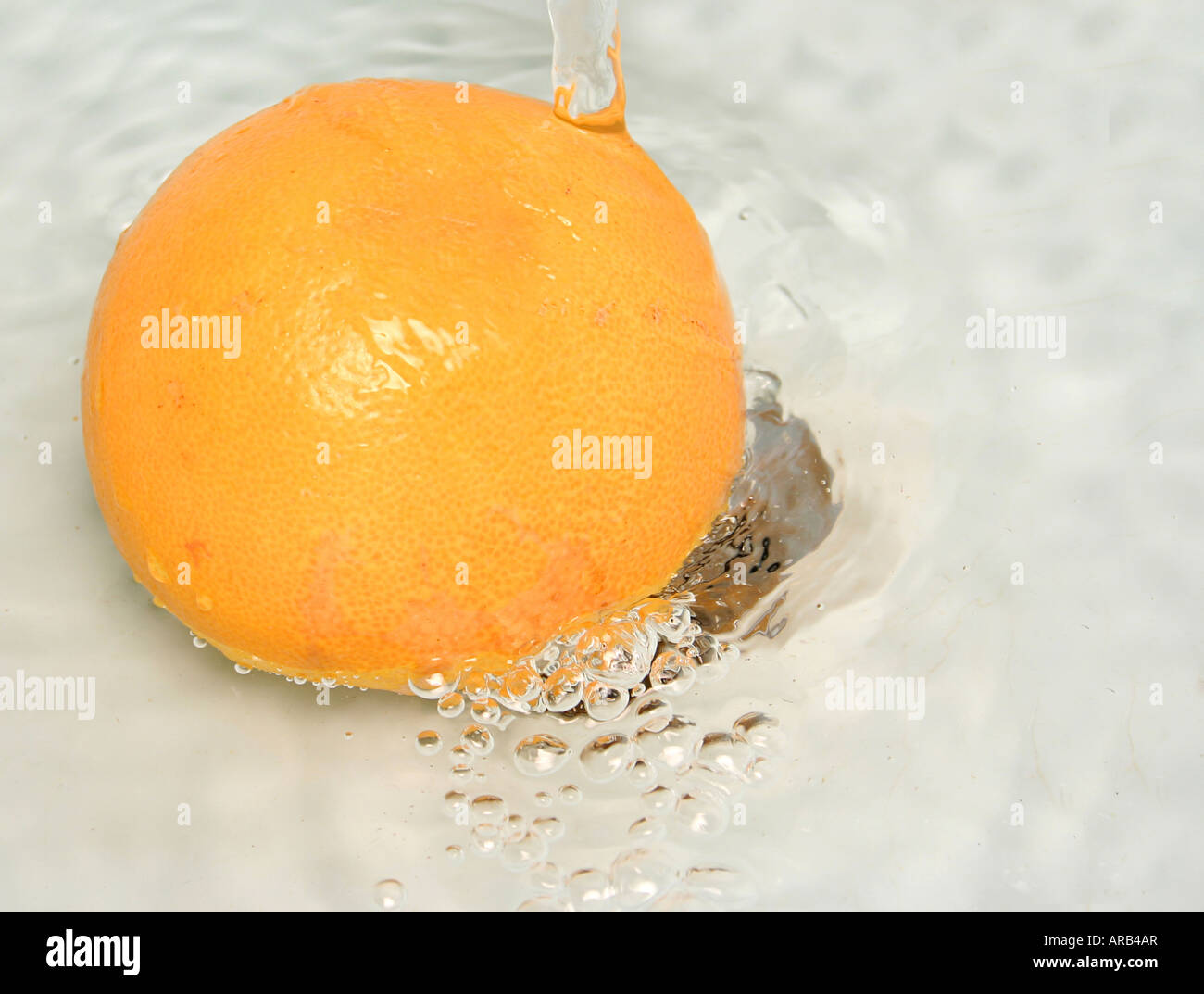 close up image of juicy orange in water Stock Photo - Alamy