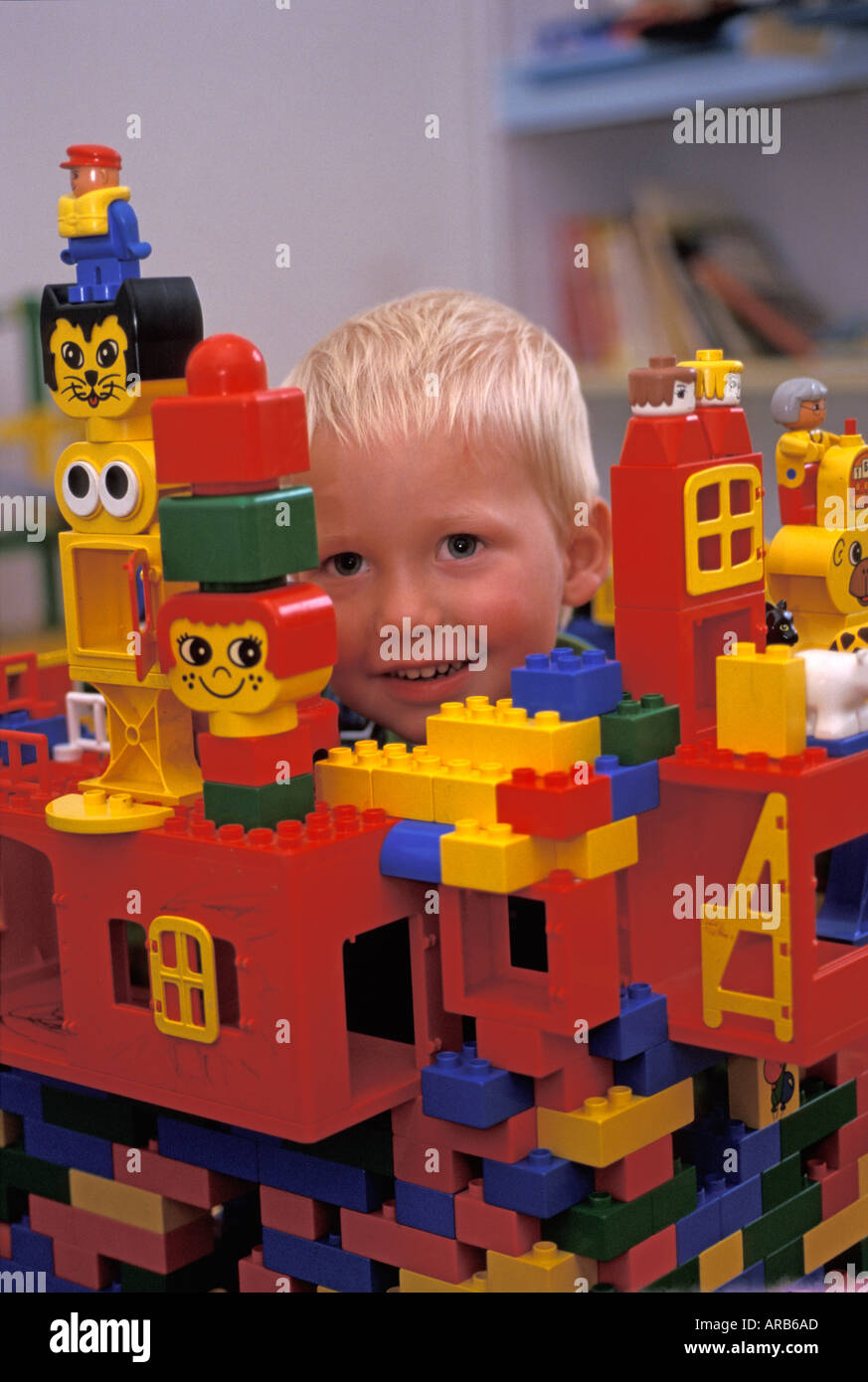 Three year old boy behind building blocks MR Stock Photo - Alamy